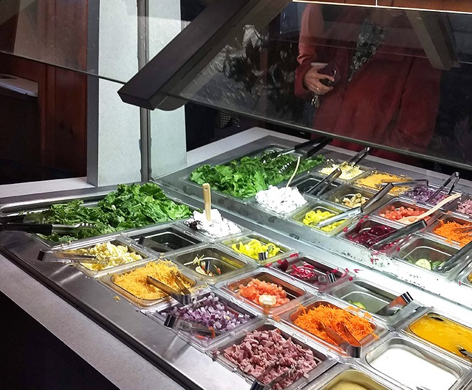 A salad bar that's a feast for the eyes&mdash;fresh ingredients lined up like soldiers ready to complement those hearty main courses.