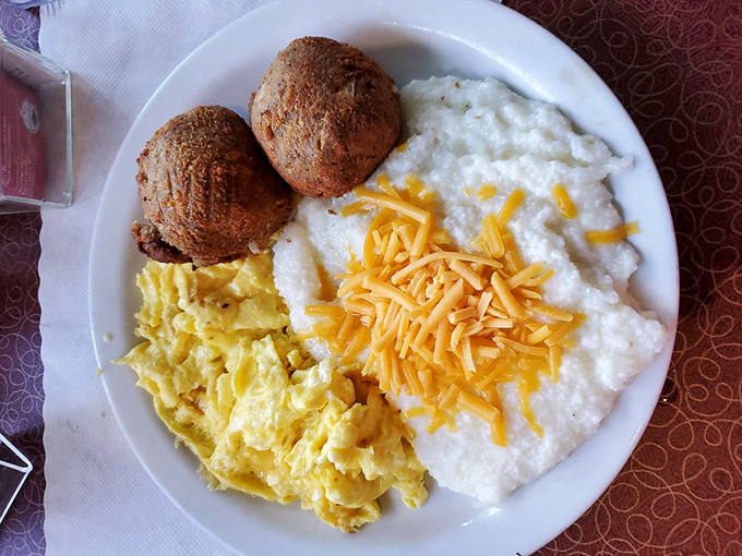 Salmon croquettes with grits and eggs&mdash;a Southern breakfast trifecta that proves fish for breakfast isn't just acceptable, it's exceptional.