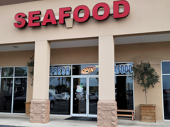 This seafood market's straightforward signage tells you everything you need to know: fresh catches await inside, no fancy marketing required. 