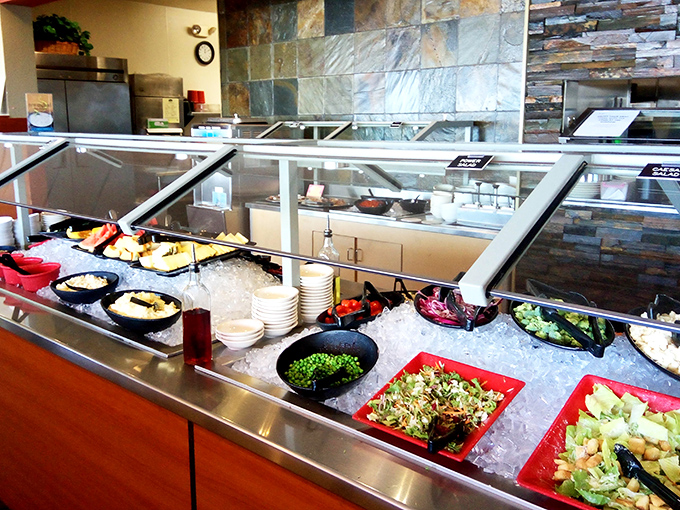 The salad bar offers fresh redemption for those who need to balance their buffet karma before returning to the dessert station.