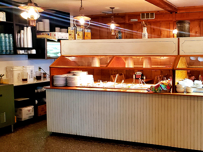 The serving line awaits its next wave of hungry patrons like a stage before the curtain rises on the day's culinary performance.