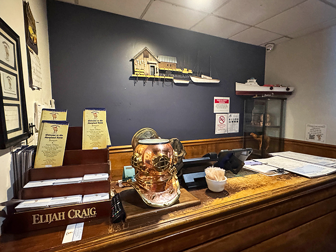 A nautical-themed reception area that sets the tone for your seafood adventure, complete with a diving helmet that's seen more stories than a library.