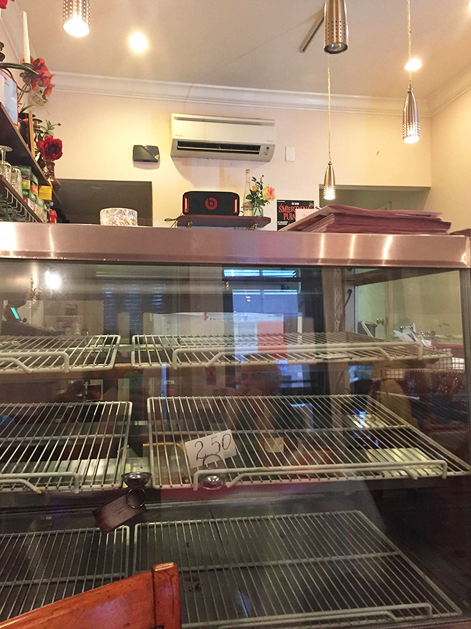 Behind this counter, Polish culinary magic happens daily. The empty display case means someone's having a very good dinner tonight.