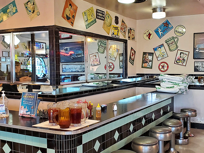 The heart of diner operations – where coffee is always brewing and servers call orders in a language all their own.