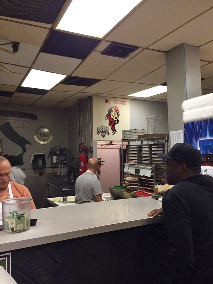 Behind every great pizza is a team that values substance over style. That Buckeye mascot watches over quality control. 