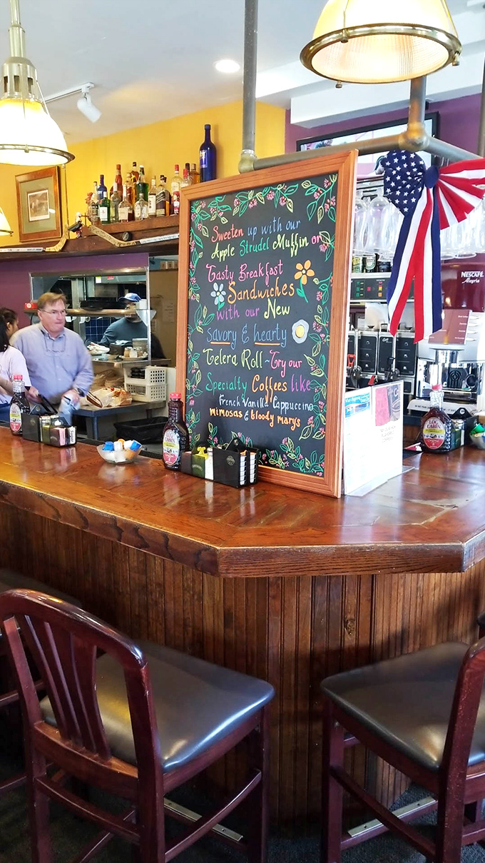 Pendant lights cast a golden glow over the polished wood bar&mdash;the perfect spot to contemplate life's important questions, like pancakes or waffles?