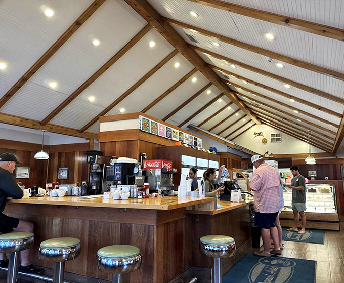 The cathedral-like ceiling and counter seating create the perfect stage for breakfast theater. Those stools have witnessed countless first bites of donut ecstasy.