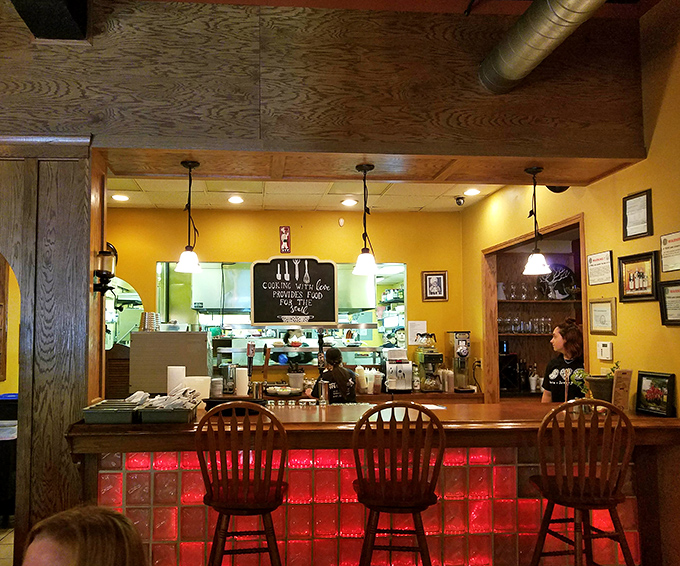 The open kitchen concept lets you witness culinary choreography in action&mdash;where "cooking with love provides food for the soul" isn't just a wall sign.