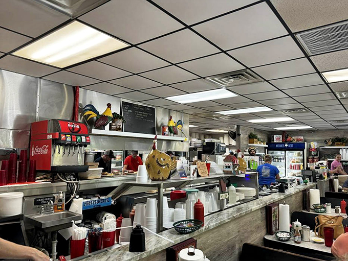 The organized chaos of a well-loved kitchen. Those herb boxes labeled "Sage" and "Basil" aren't just decorative—they're promises of flavor to come.