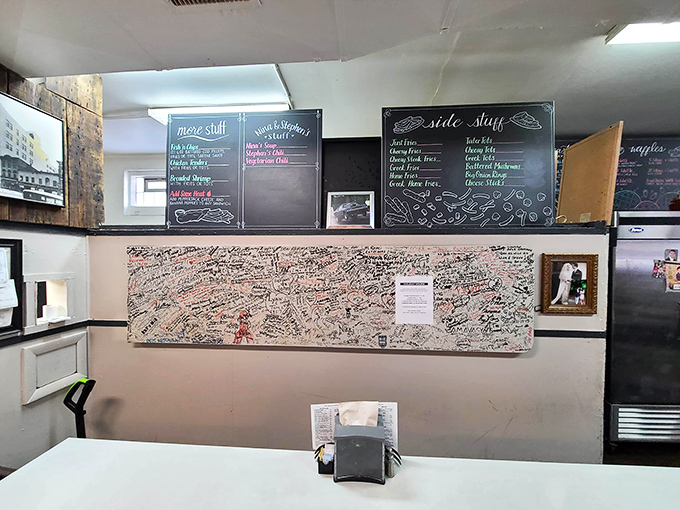 The wall of customer signatures tells the real story&mdash;this isn't just a restaurant, it's a community landmark where memories are made between bites.