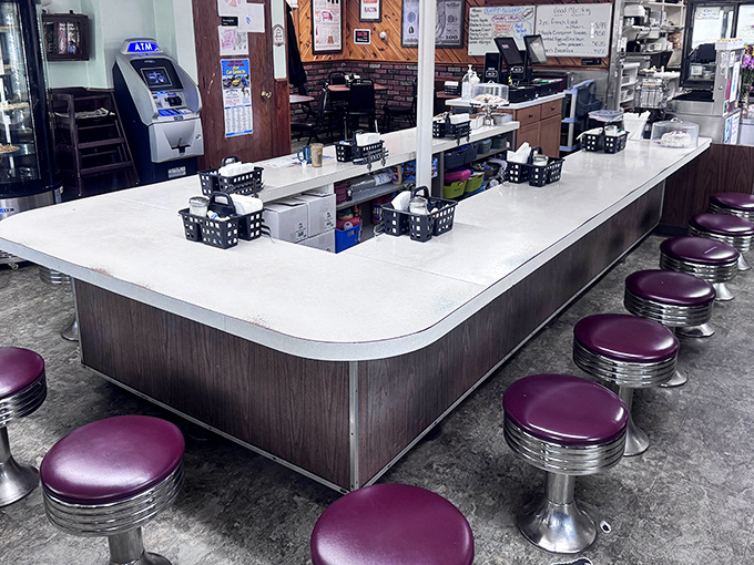 The counter's horseshoe design isn't just practical&mdash;it's a stage where short-order cooking becomes performance art worth the price of admission.