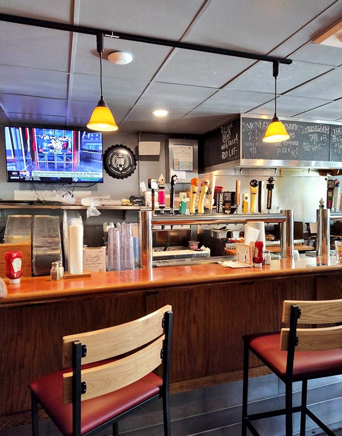The bar's warm wood tones and pendant lighting create that perfect "stay awhile" atmosphere. Where one beer easily turns into sampling the entire draft list.