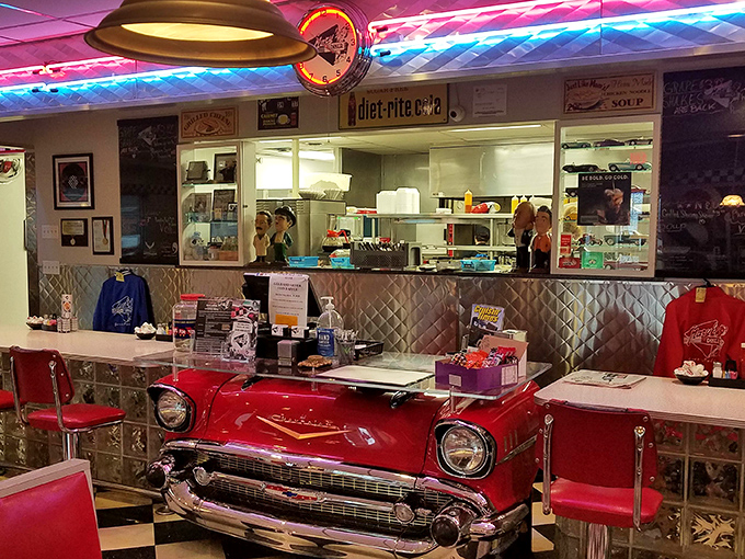 Neon lights illuminate the service area where magic happens&mdash;turning simple ingredients into the comfort food that makes you want to hug the cook.