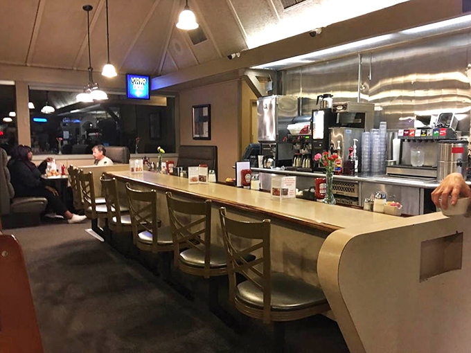 Counter seating at dusk&mdash;where solo diners find community, coffee cups are never empty, and servers know your order before you sit down.
