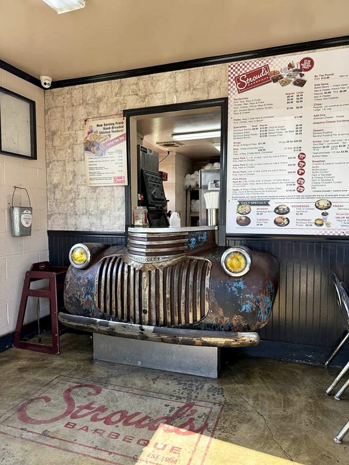 Where barbecue meets automotive history. This clever repurposing of a classic Chevy grille as an order counter speaks volumes about Stroud's creative spirit.