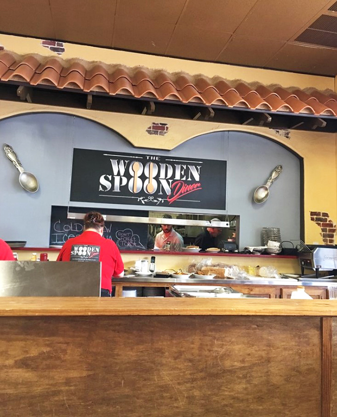 The kitchen pass reveals the orchestrated chaos where breakfast magic happens, with staff working in synchronized breakfast ballet.