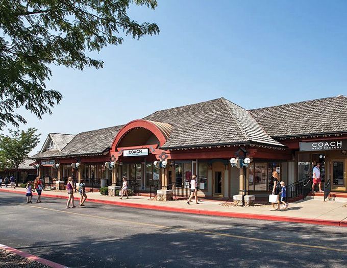 The Coach storefront beckons shoppers with the siren song of luxury brands at prices that won't require explaining to your financial advisor. 