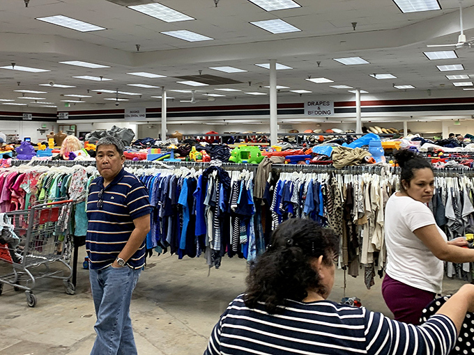 The bustling interior reveals the true scale of Valley Value Center, where shoppers navigate aisles like explorers charting unknown territory.