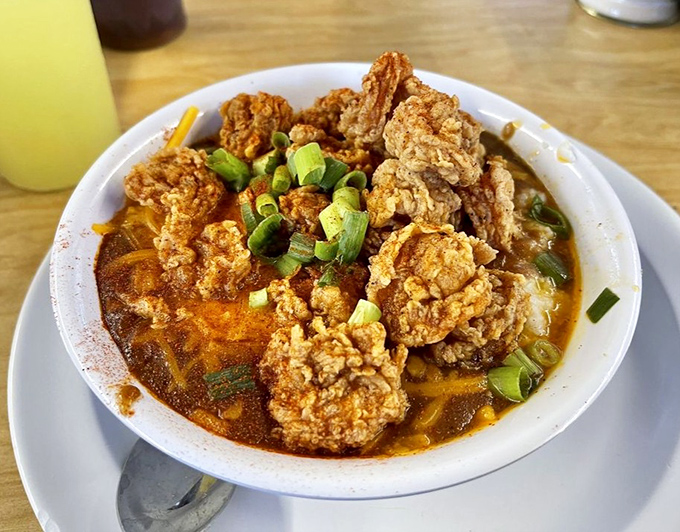 Fried shrimp lounging in a spicy broth like they're at a spa. This isn't just food&mdash;it's edible art with a Southern accent.