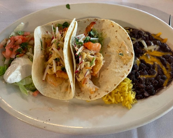 These shrimp tacos tell the perfect three-act story: fresh tortilla, perfectly seasoned seafood, and the supporting cast of toppings that bring it all together.