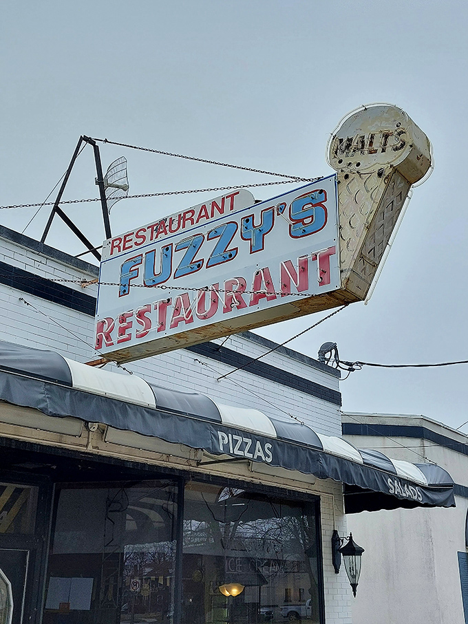 The vintage signage proudly announces "FUZZY'S" like it's the answer to a question you didn't know you were asking: "Where should we eat today?"