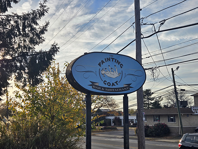 The sign stands as a beacon for hungry travelers, promising good times and better food just beyond those doors.