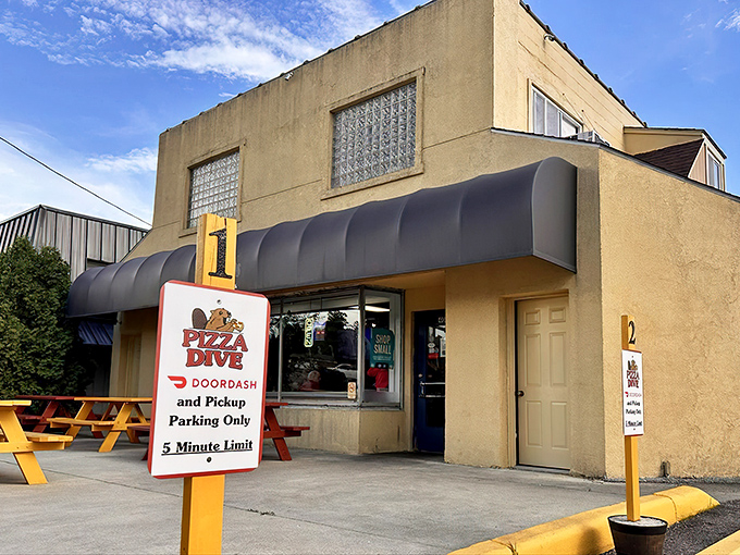 The Pizza Dive sign stands guard, promising delicious rewards for those wise enough to stop at this unassuming spot.
