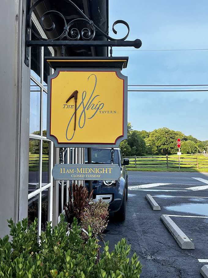 The signature yellow sign beckons like a lighthouse for the hungry. Note the hours &ndash; closed Tuesdays, because even perfection needs a day off.