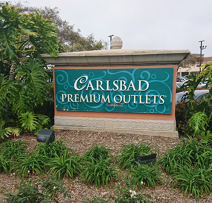 The entrance sign, welcoming you to a place where your credit card will get more exercise than you've had all month.