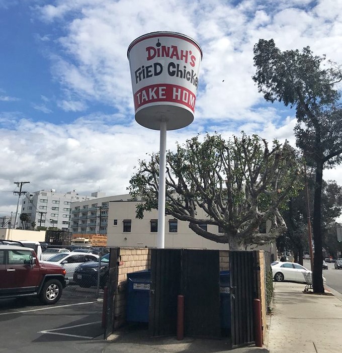 The giant chicken bucket sign stands tall against the California sky&mdash;a landmark that's guided hungry travelers for generations.