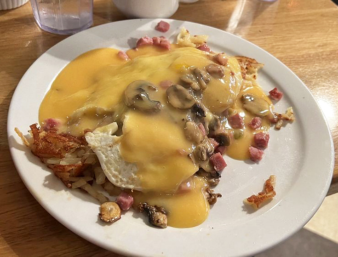 This isn't just breakfast&mdash;it's a golden-hued masterpiece where cheese, eggs, and ham perform a symphony on crispy hash browns.