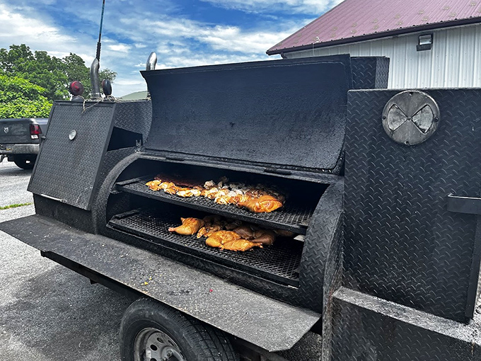 The source of all that happiness&mdash;a serious smoker doing serious work. Those chickens aren't just cooking, they're transforming into something transcendent.