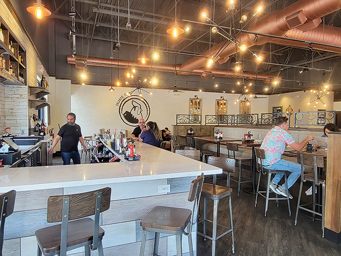 Where breakfast professionals work their morning magic. That copper ductwork overhead isn't just functional&mdash;it's part of the warm ambiance.