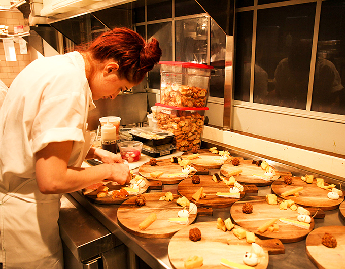 Behind the scenes, culinary magic happens with focused precision &ndash; each plate assembled with care that you can taste in every bite.