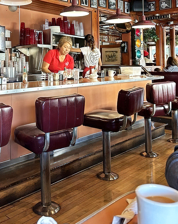 Servers who've mastered the art of appearing with coffee just as your cup hits empty—a sixth sense developed through years of diner intuition.