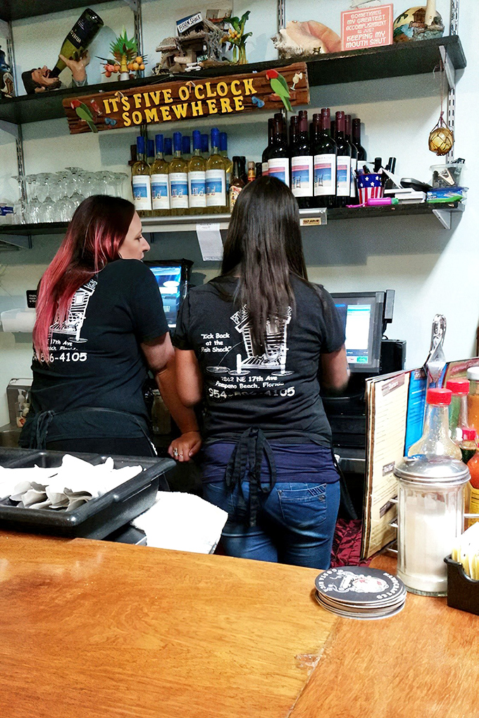 Behind the scenes, where seafood magic happens under a sign that wisely reminds us "It's Five O'Clock Somewhere."