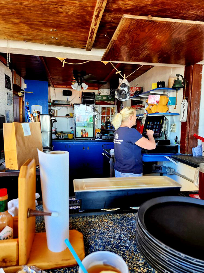 Behind the counter, the real magic happens – where fresh fish becomes the stuff of legend.