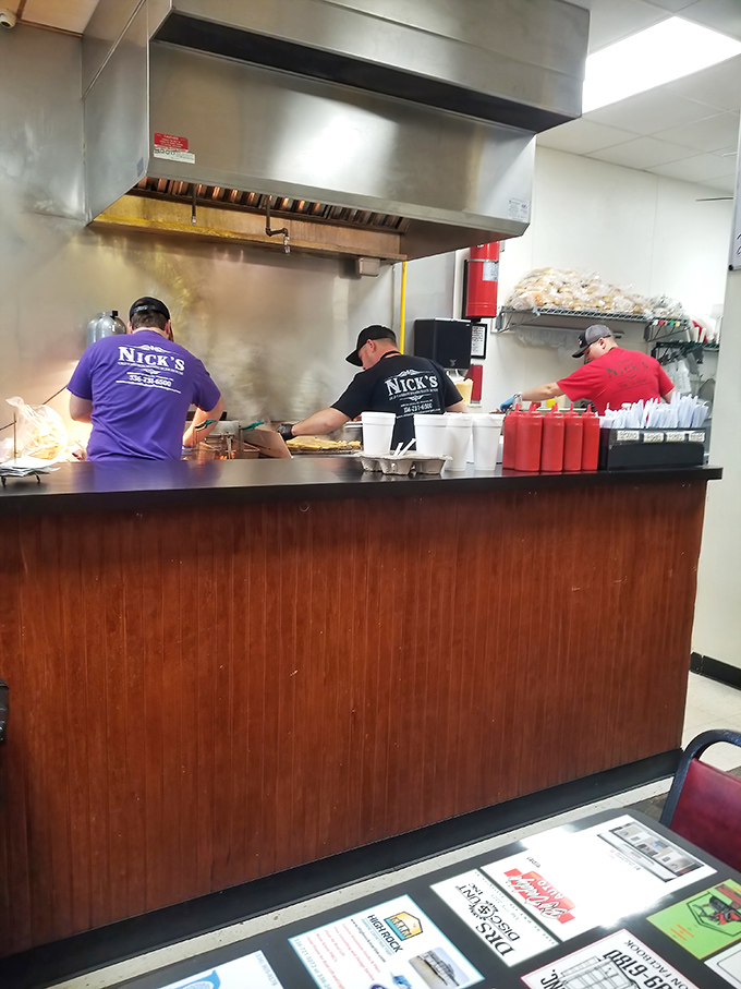 Nick's staff works with the synchronized precision of people who know exactly what they're doing. Those shirts aren't just uniforms&mdash;they're badges of honor.