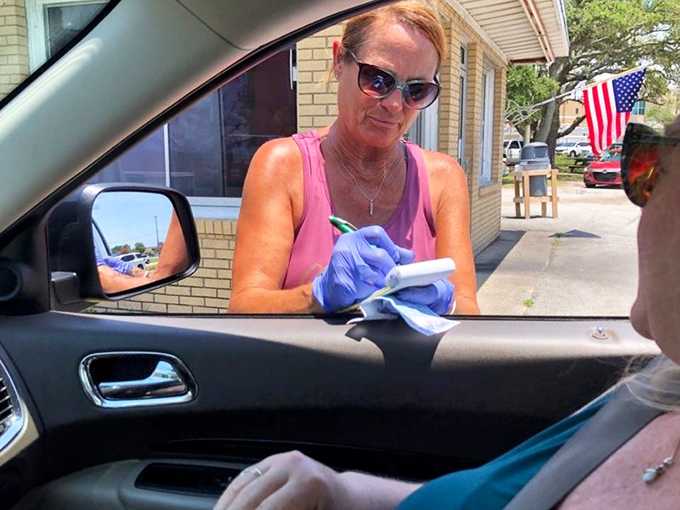 The time-honored tradition of carhop service continues. Order taken with a smile, delivered with efficiency&mdash;American dining culture preserved.