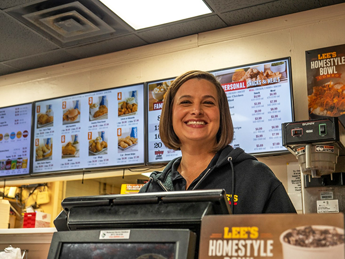 The smile says it all—genuine Southern hospitality served alongside some of Richmond's most crave-worthy chicken.
