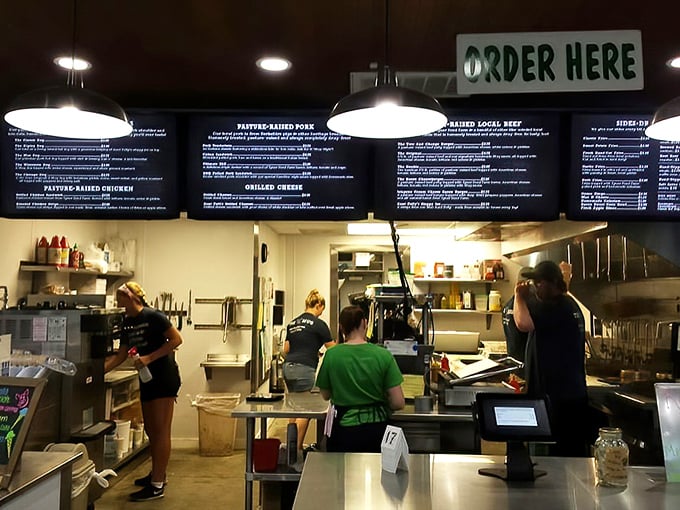 A covered patio with rustic wooden tables where memories are made between bites. Those colorful umbrellas add just the right touch of cheerful ambiance.