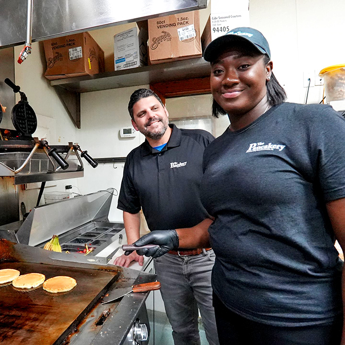 Behind every great pancake is a dedicated team flipping their way into breakfast history. The smiles are as genuine as the ingredients.