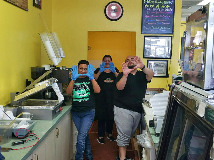 Smiling faces behind the counter prove that great food comes from people who genuinely love their craft.