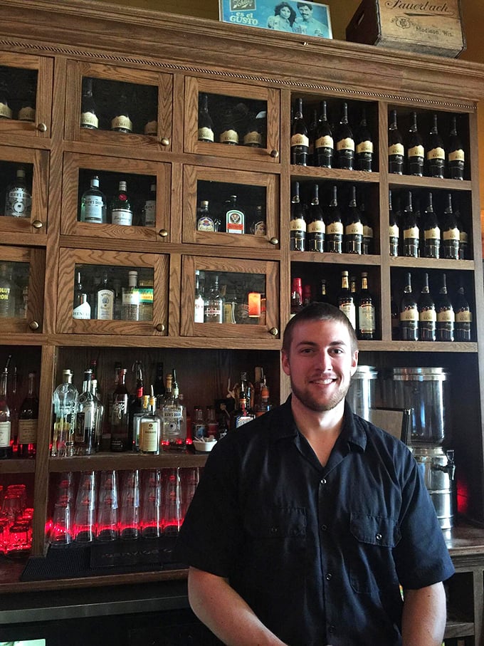 Behind every perfect old fashioned is a bartender with the wisdom of generations. The bottles stand at attention like soldiers guarding liquid gold.