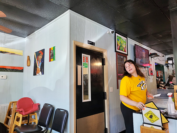 Service with a smile in a yellow shirt &ndash; the universal uniform of "your food's gonna be great."
