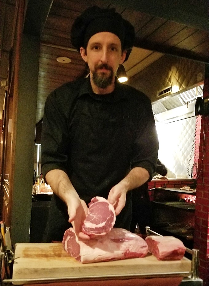 The chef selects each cut with expert precision&mdash;these hands understand that great steak begins long before it meets the grill.