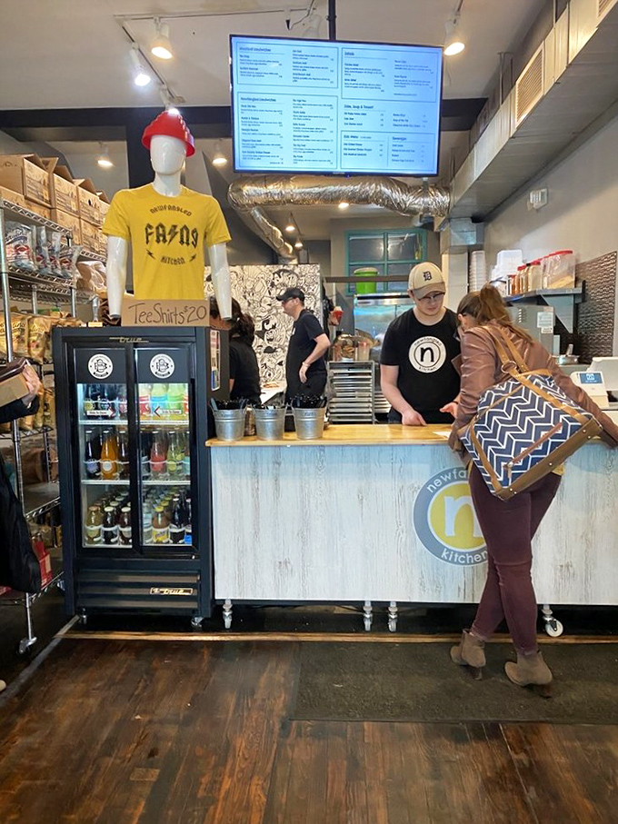 The heart of any great eatery—dedicated staff crafting each order with care. Those branded shirts aren't just uniforms; they're badges of sandwich honor.