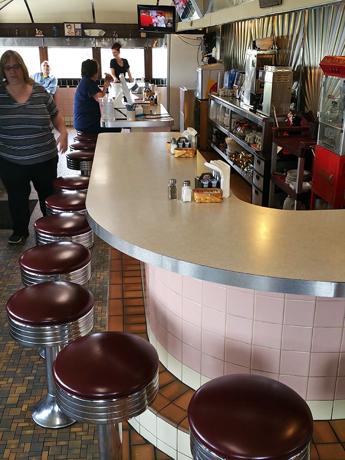 Where diner dreams come true &ndash; the counter staff orchestrating the morning rush with the precision and grace of seasoned performers.