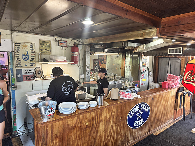 Where the food meets the folks—staff working with the focused precision of artists who know their canvas is your plate.