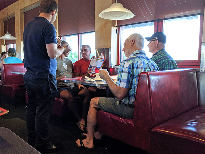 The dance of dining: attentive servers taking orders while customers debate the eternal question&mdash;sweet or savory?